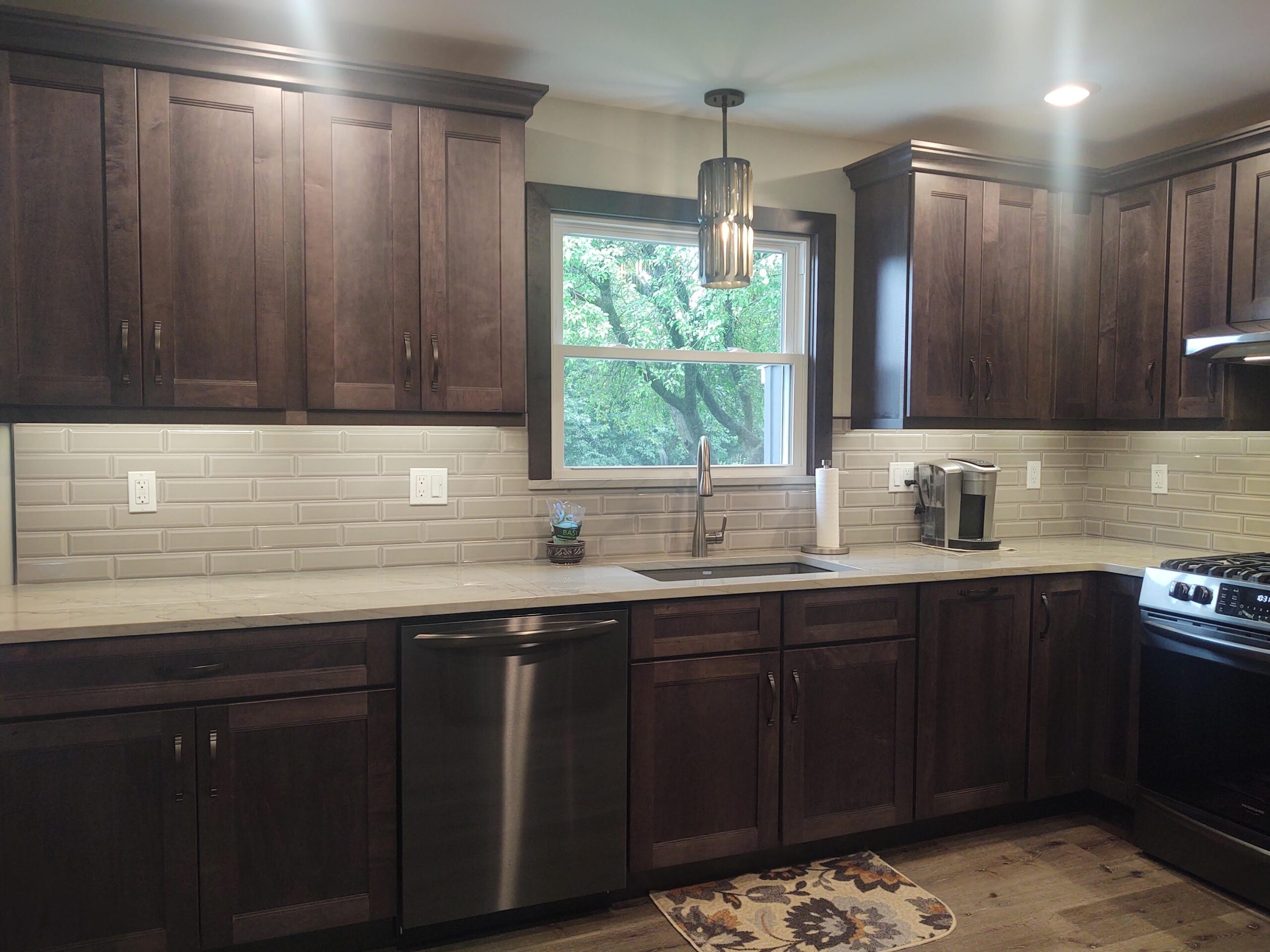 White Subway Tile Backsplash Brown Cabinets